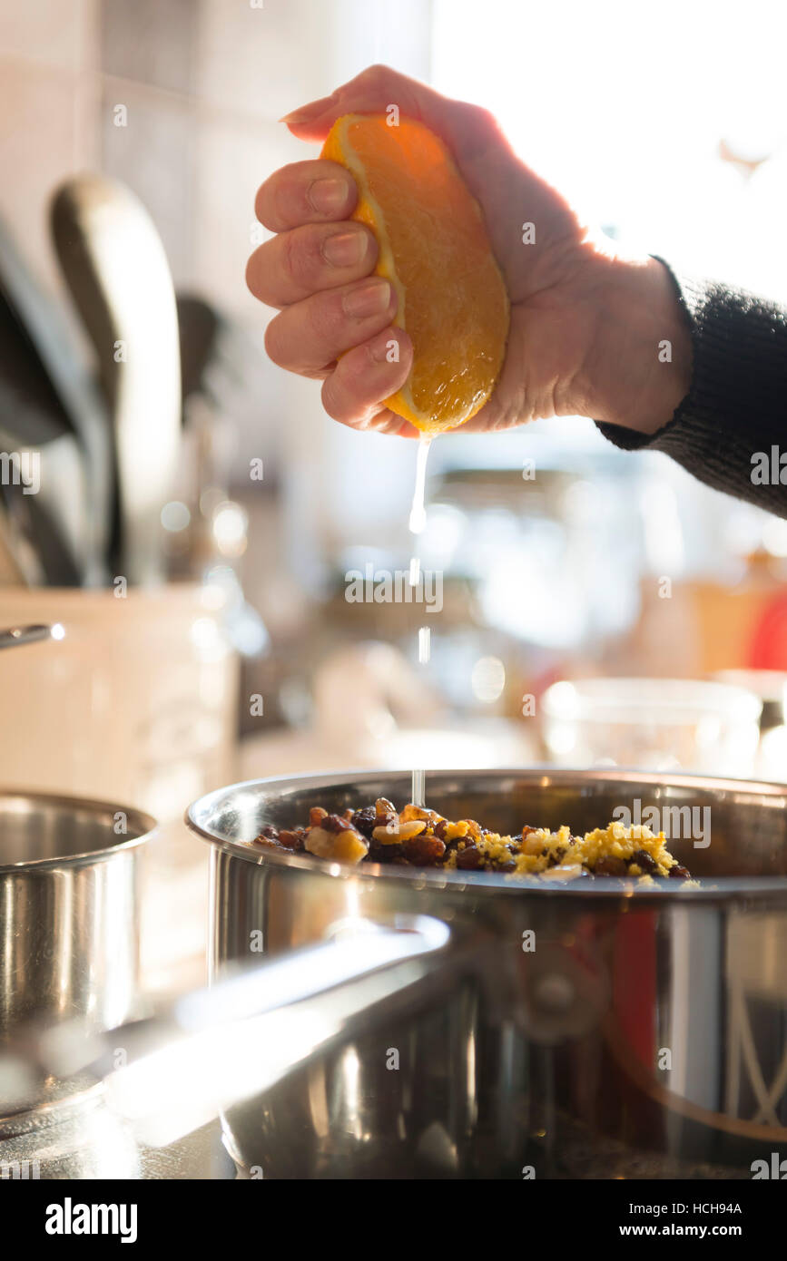 Hand squeezing orange hi-res stock photography and images - Alamy