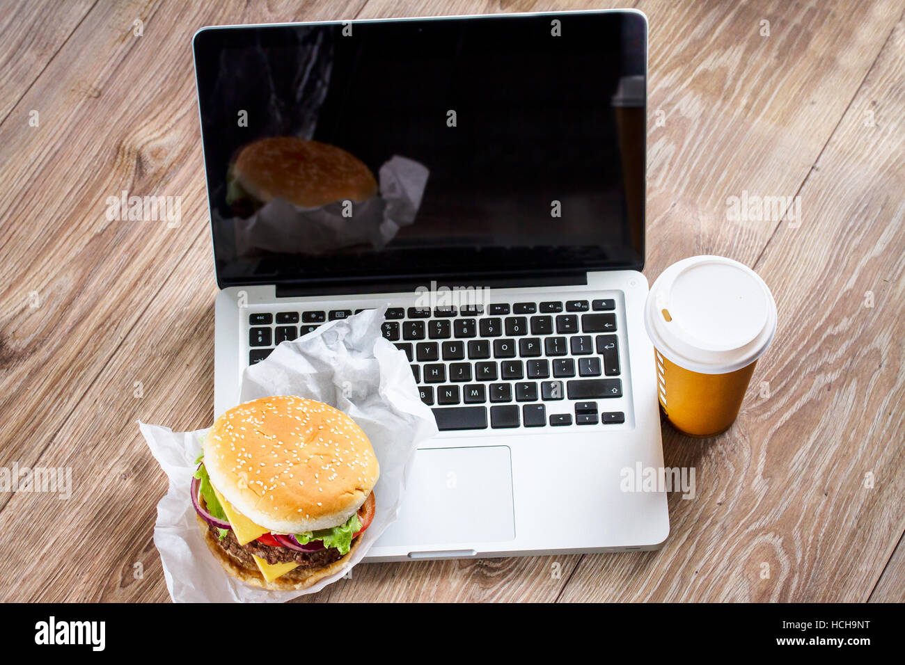 Eating at work place Stock Photo - Alamy