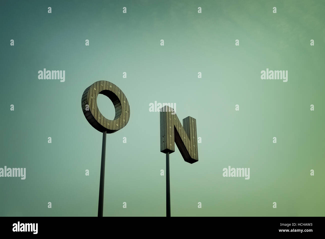 On sign against turquoise blue sky Stock Photo - Alamy
