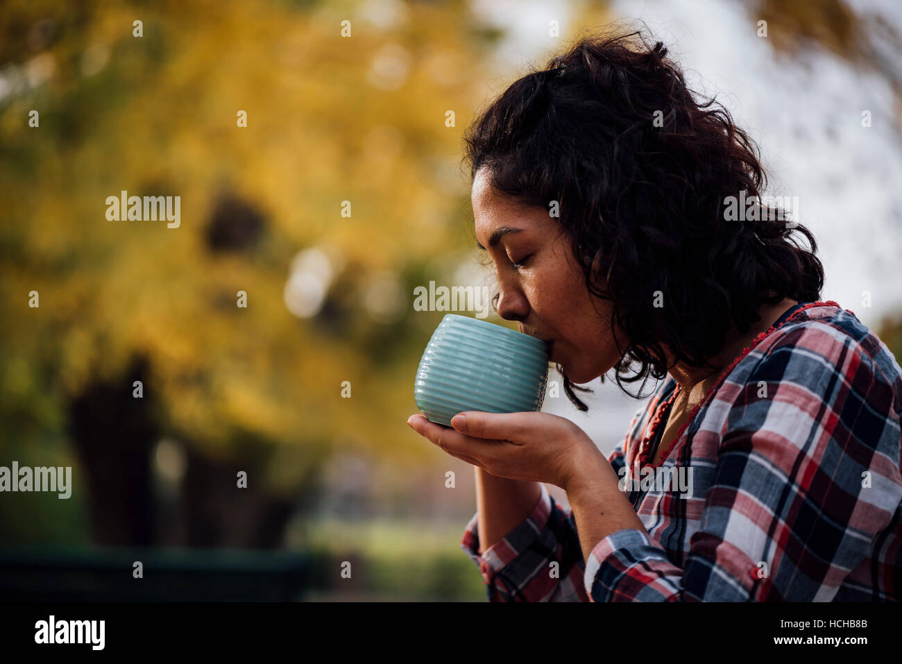 Woman drinking tea in the garden hi-res stock photography and images ...