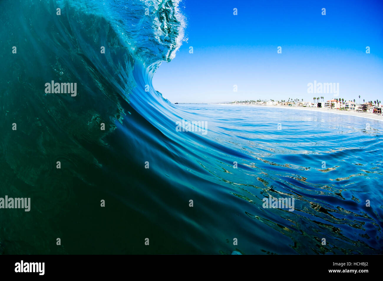 Water angle of an ice blue wave breaking offshore of a beach in San ...