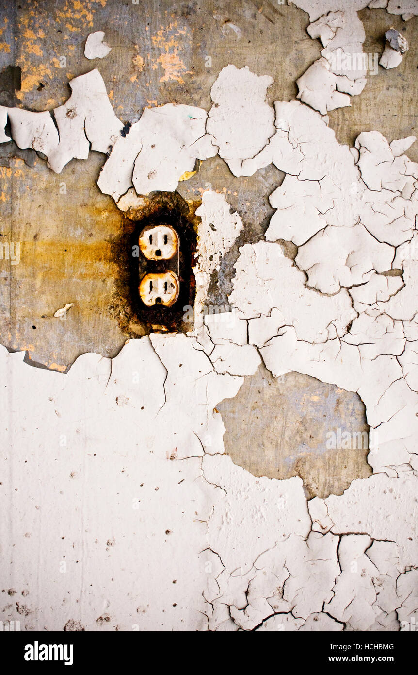 An old rusted electrical socket on a cracked painted wall Stock Photo ...
