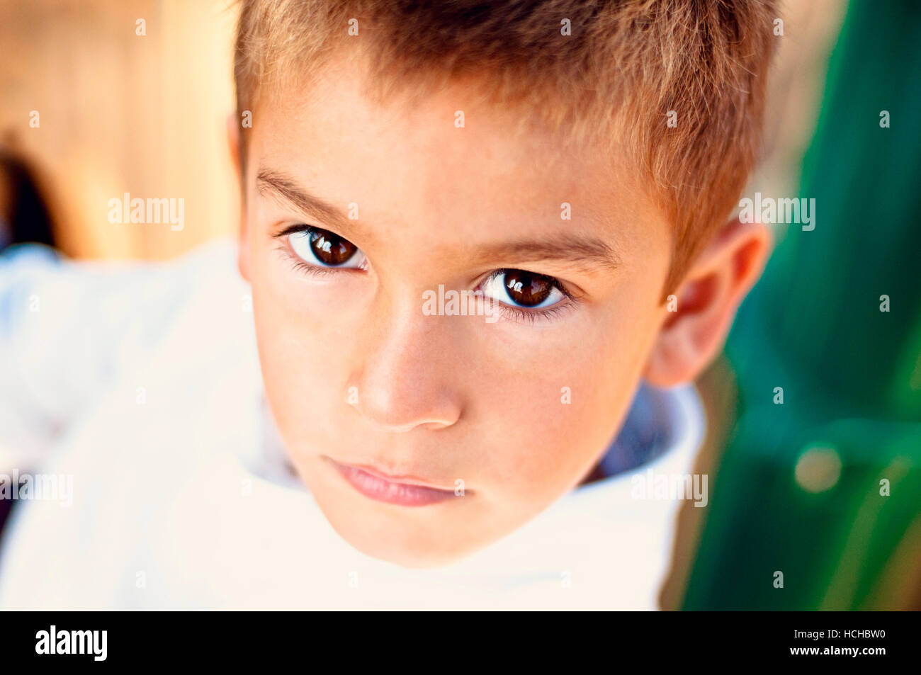 A young boy looking back with big eyes Stock Photo - Alamy