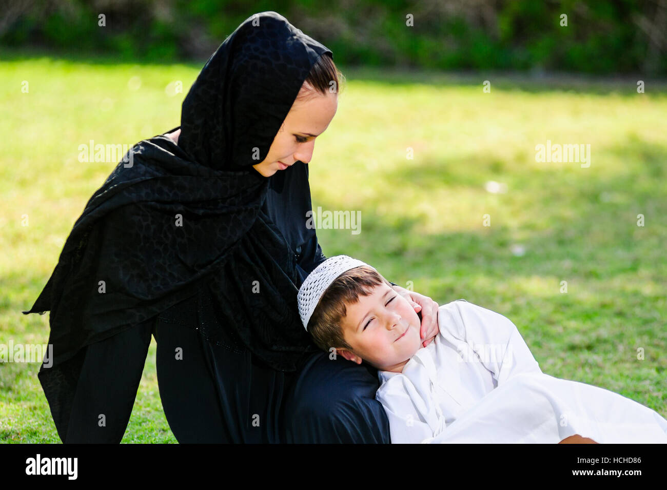 Middle eastern father and son playing with toy plane Stock Photo - Alamy
