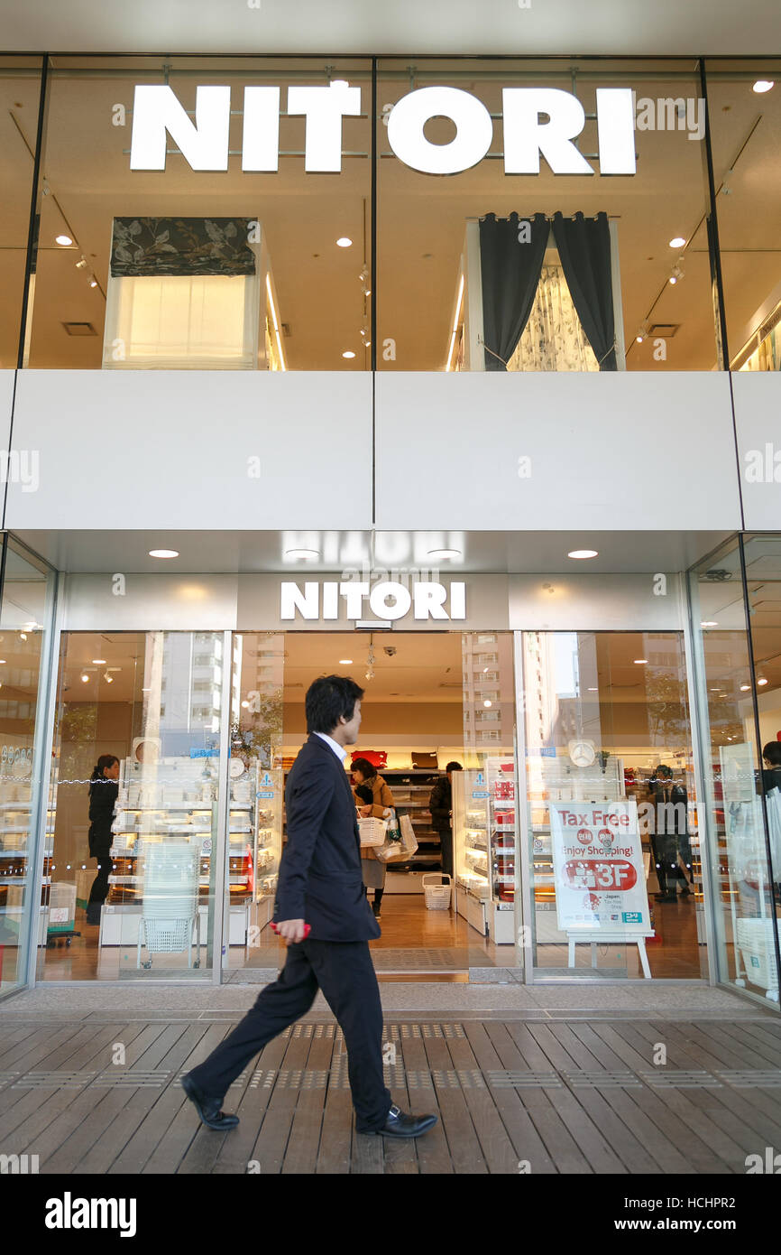 A man walks past the new Nitori department store in Shinjuku's ...