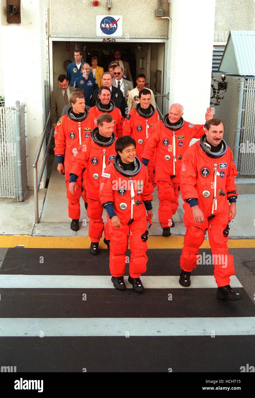 The STS-95 crew leave the Operations and Checkout Building in their ...