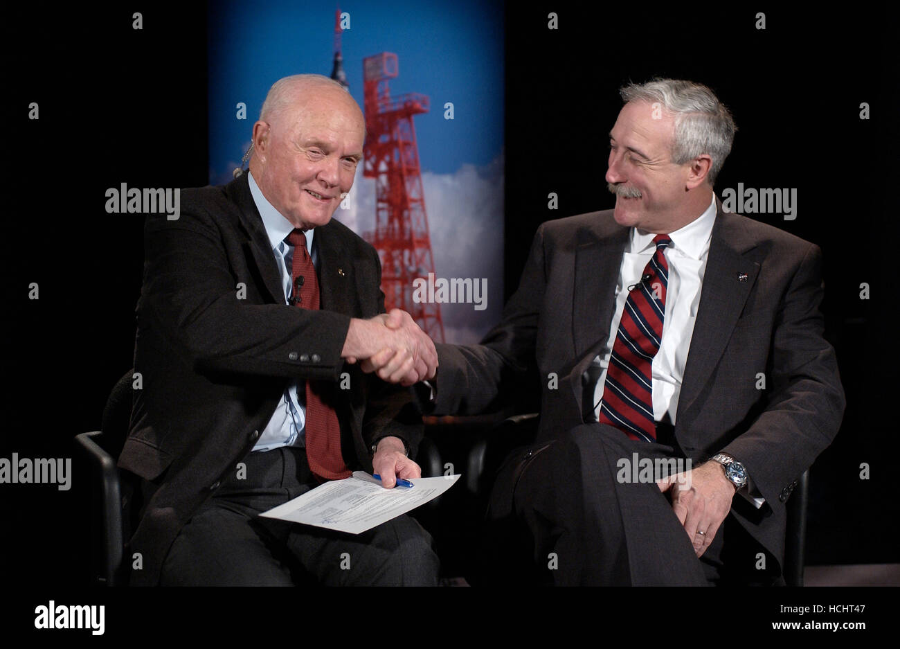 Former United States Senator John H. Glenn, Jr., left, shakes hands ...