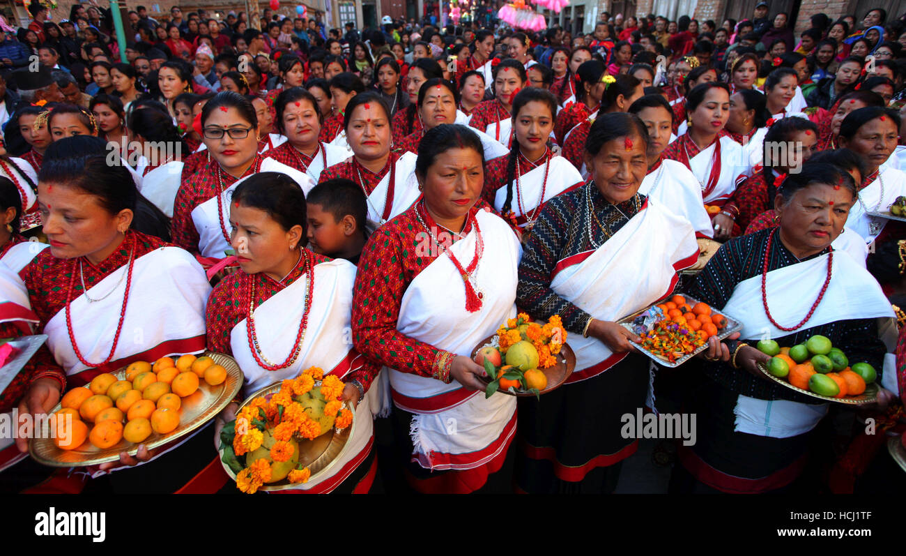Kirtipur, Nepal. 9th Dec, 2016. Devotees stand to offer prayers to ...