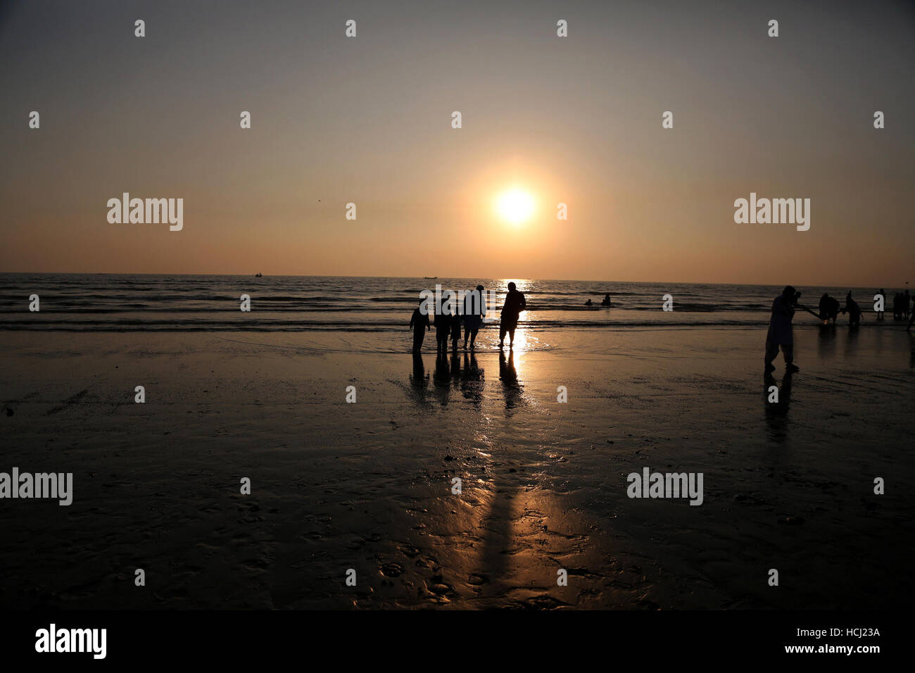 Karachi. 9th Dec, 2016. Tourists are seen on the beach at sunset in ...