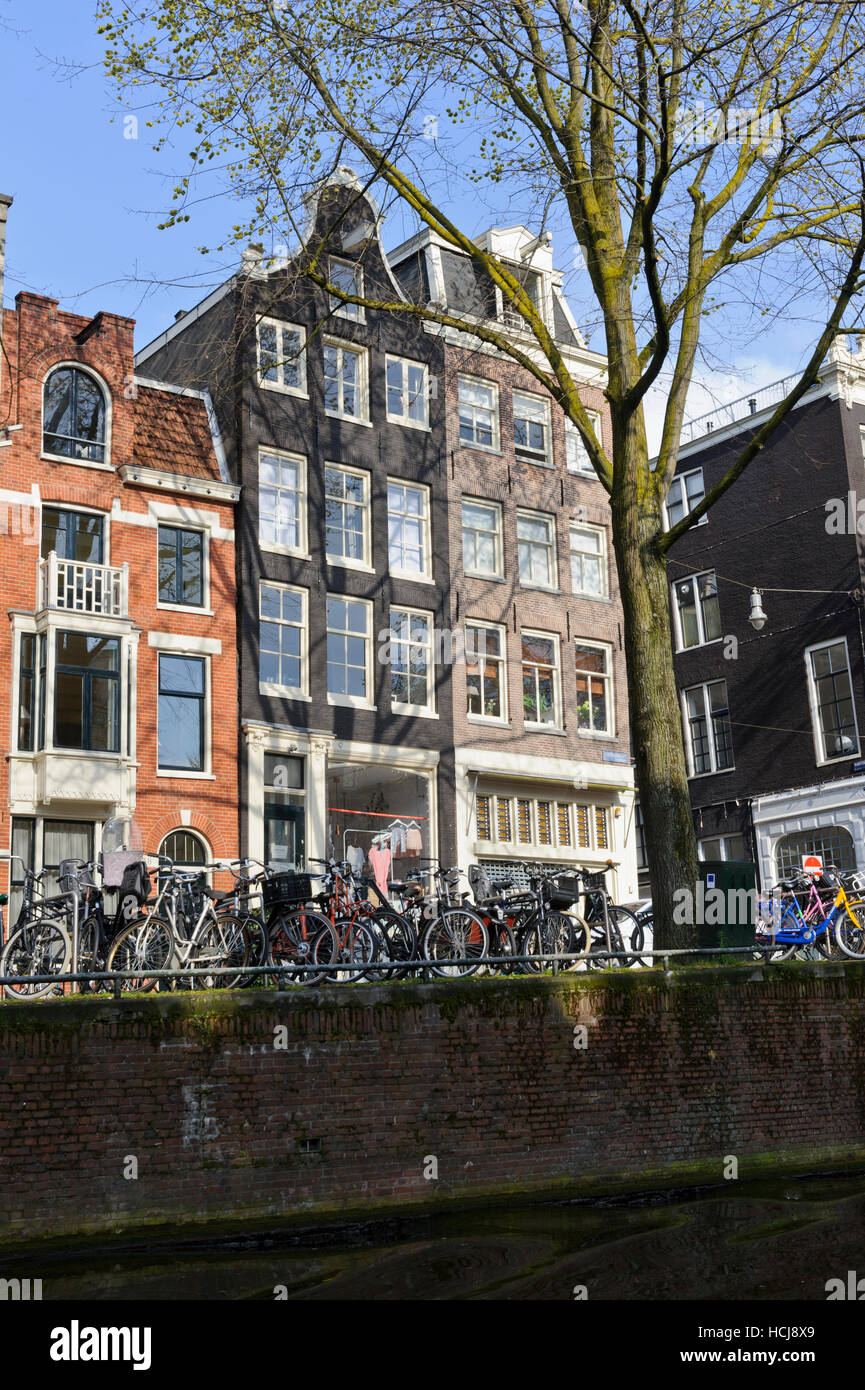 Typical buildings by the canal in the City of Amsterdam, Holland ...