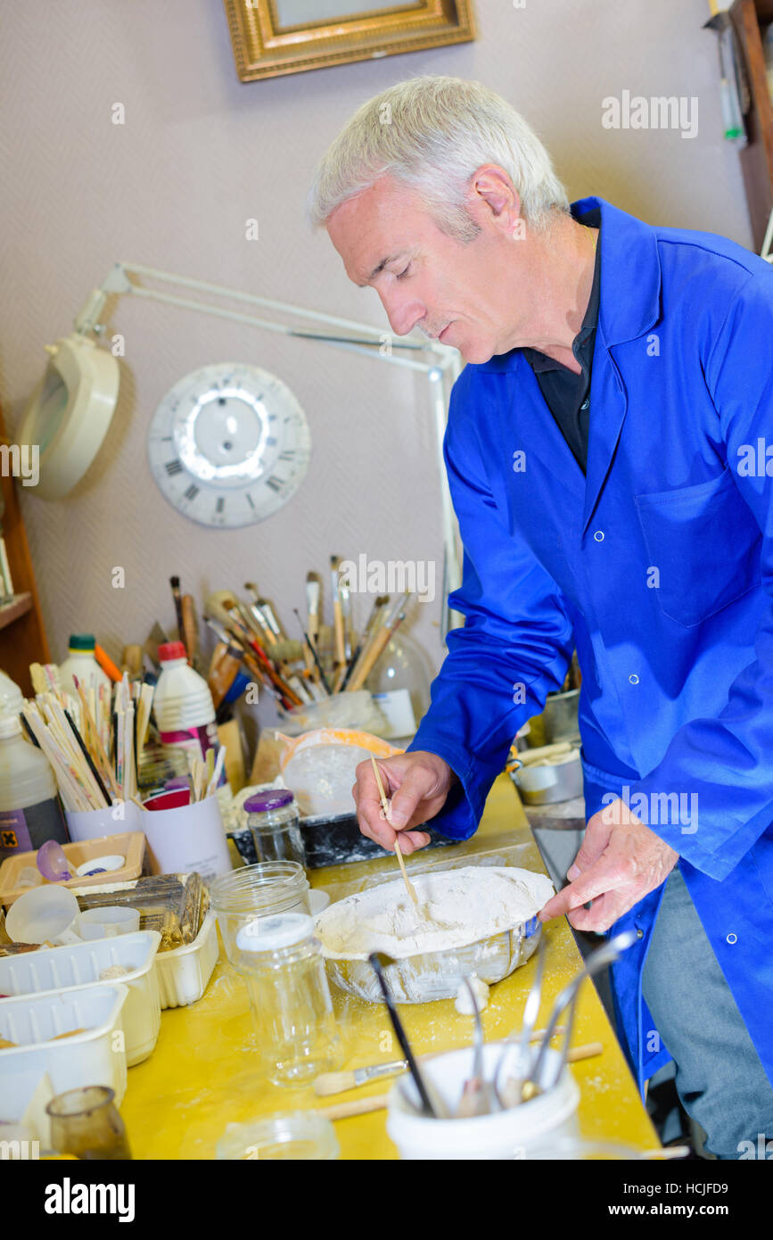 artist mixing a mixture Stock Photo - Alamy