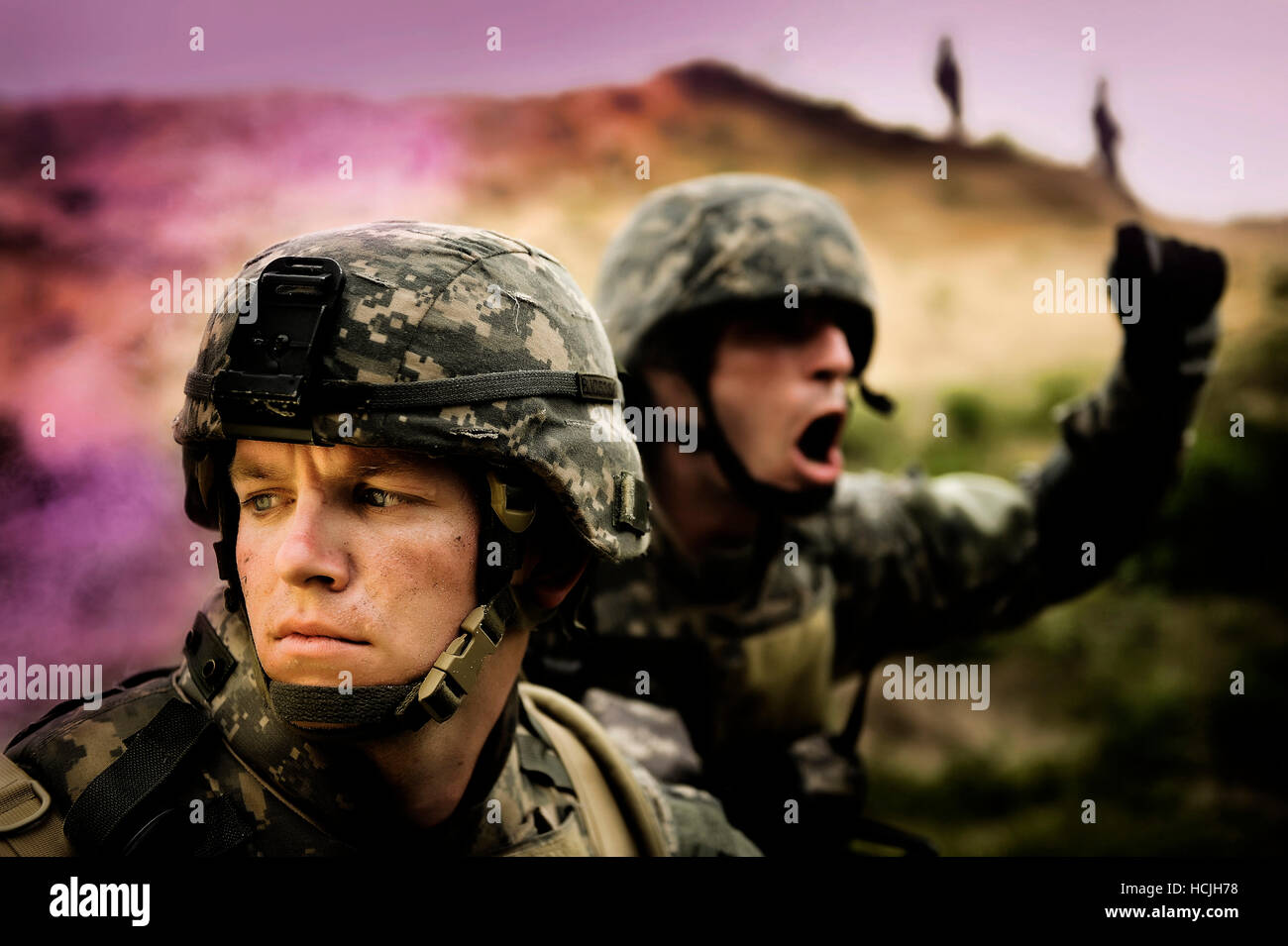 Soldiers demonstrate tactical maneuvers on sand dunes by using smoke as ...