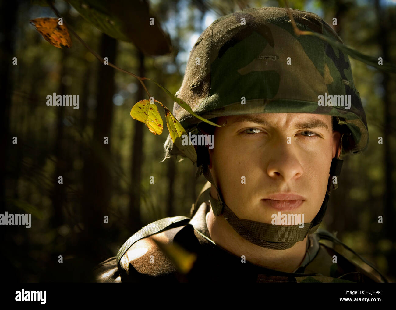 An airman stands under a tree during a security forces demonstration ...