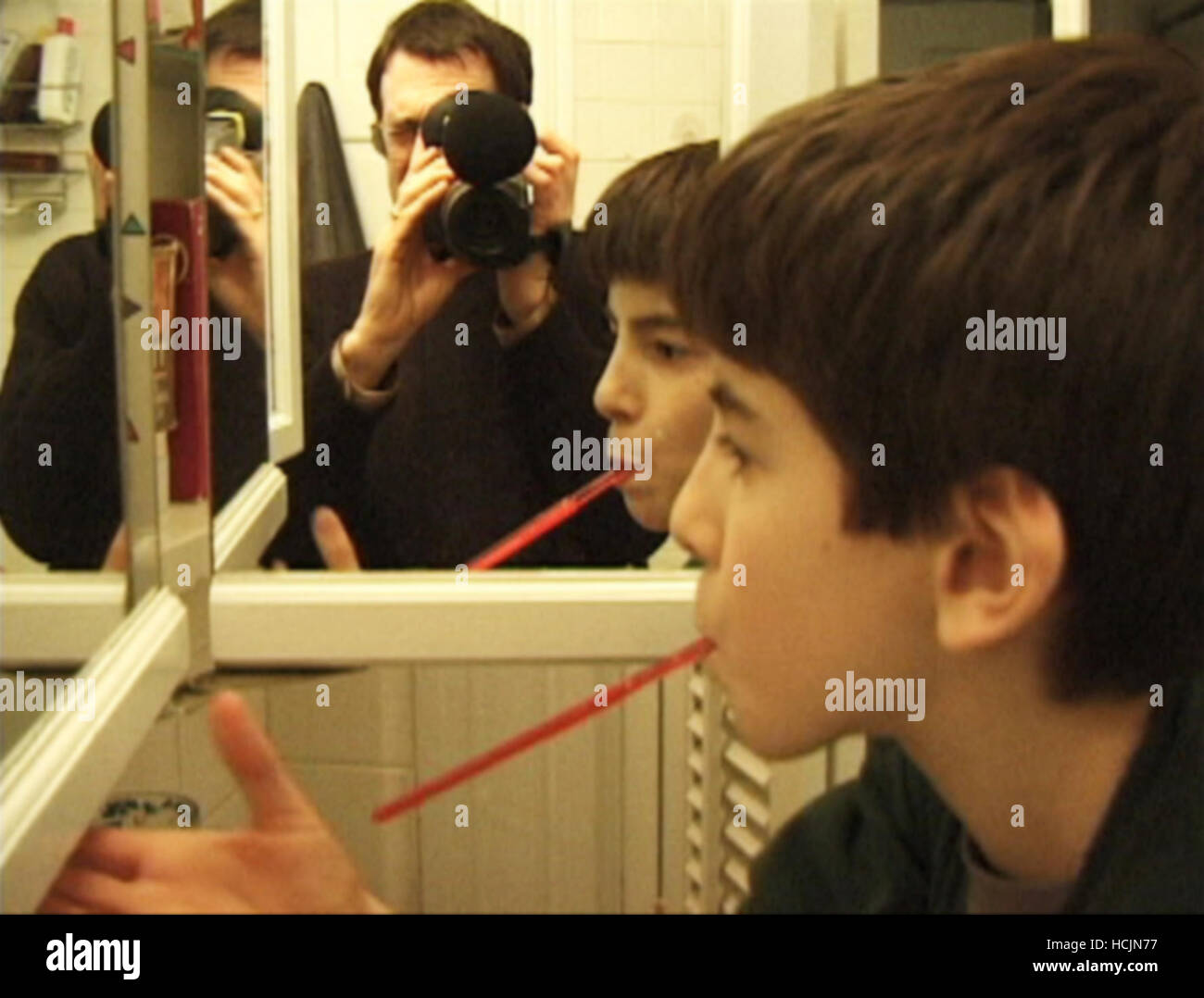 PHOTOGRAPHIC MEMORY, director Ross McElwee (left, in mirror), Adrian ...