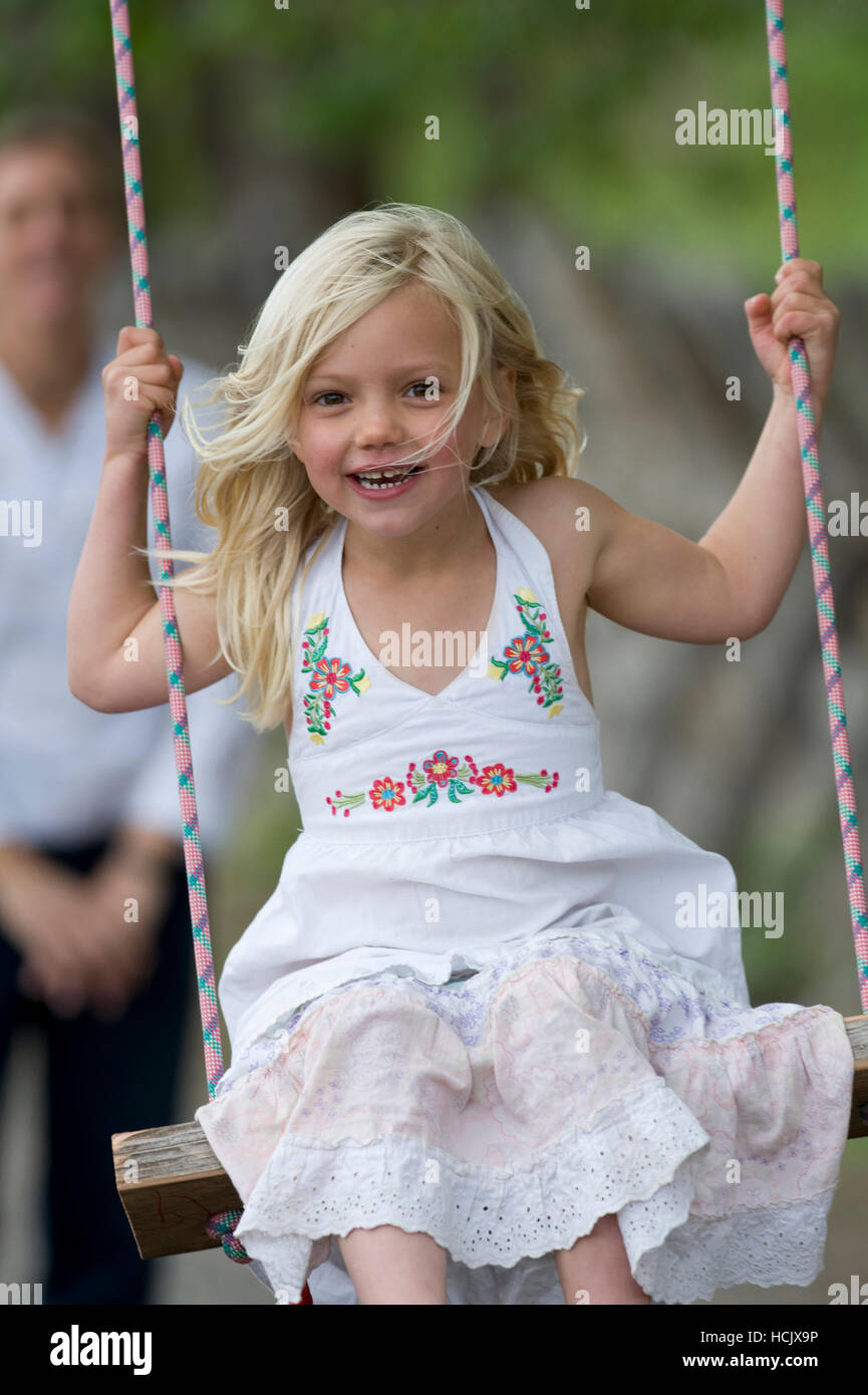 Blonde, barefoot little girl wearing a summer dress gets pushed by her ... Blonde, barefoot little girl wearing a summer dress gets pushed by her ...