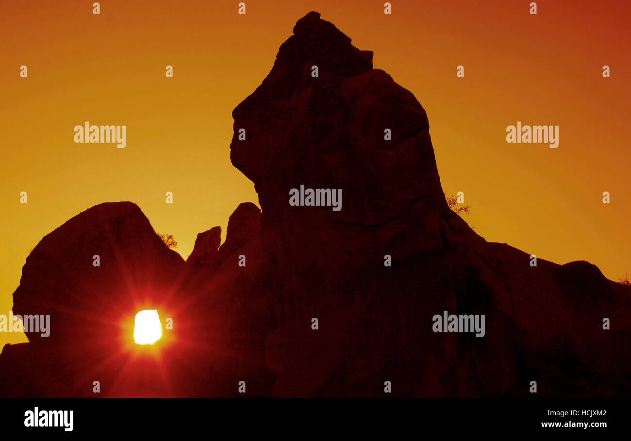 Sunset through a huge rock hi-res stock photography and images - Alamy