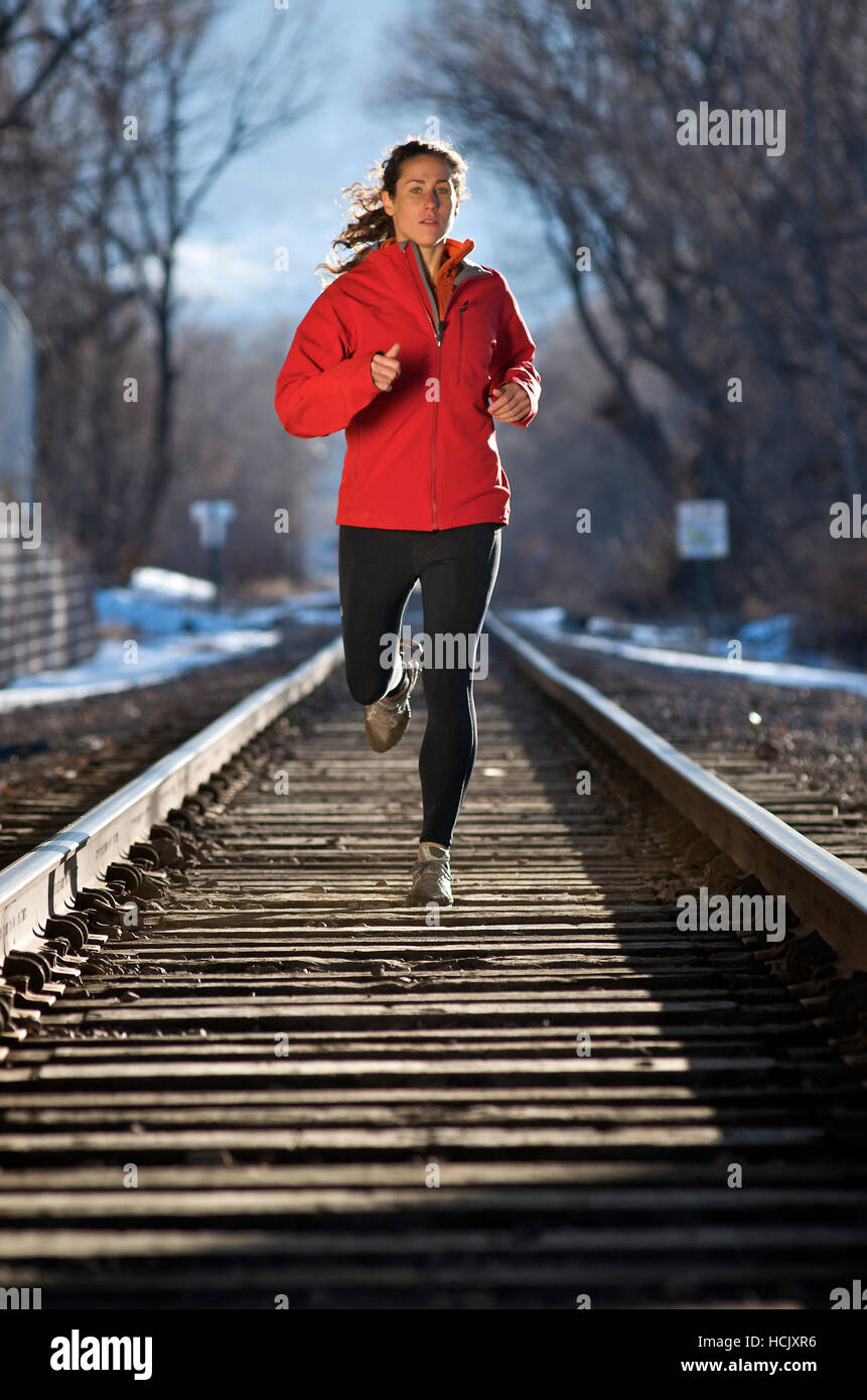 Laura Shultz taking an run on a winter evening along the rail lines in ...