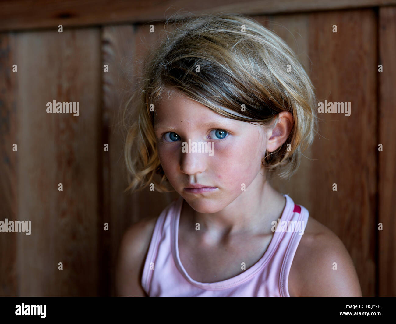 girl stares at the camera, at her mom Stock Photo - Alamy