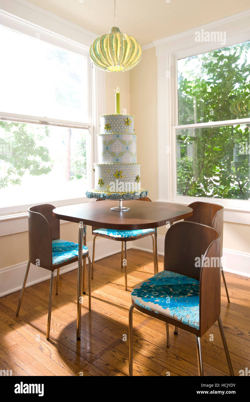 A stylized birthday cake complements the furnished surroundings and ...
