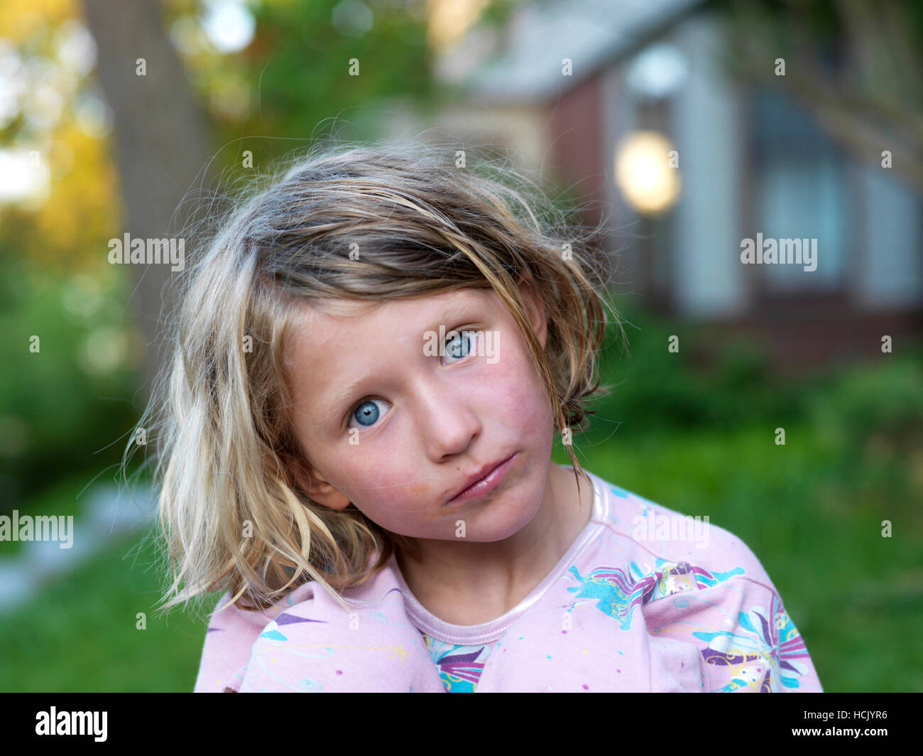 Young girl stares at the camera Stock Photo - Alamy