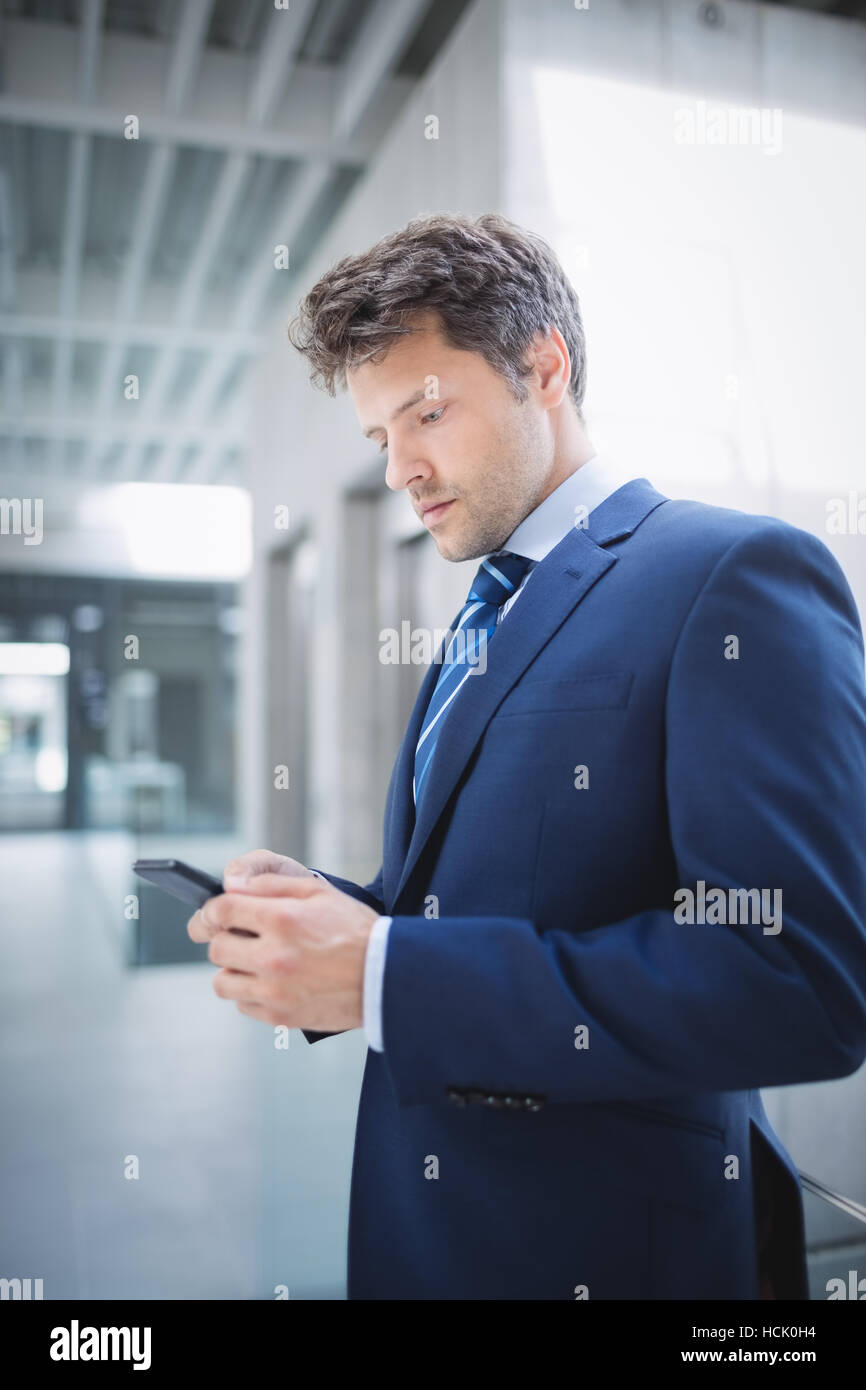 Businessman using mobile phone Stock Photo - Alamy