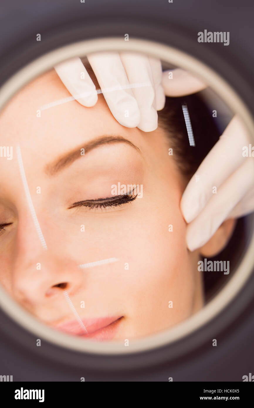 Dermatologist examining female patient skin Stock Photo - Alamy