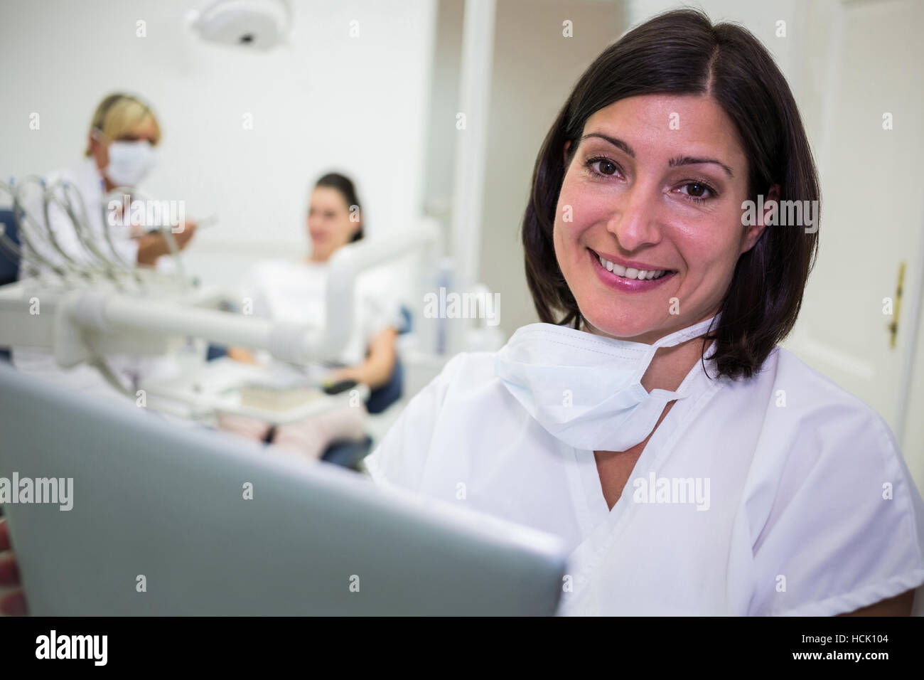 Happy female dentist using hi-res stock photography and images - Alamy