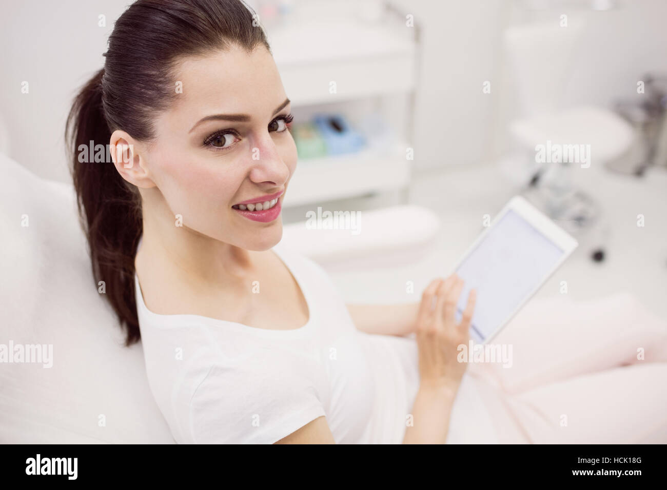 Beautiful women using digital tablet Stock Photo - Alamy