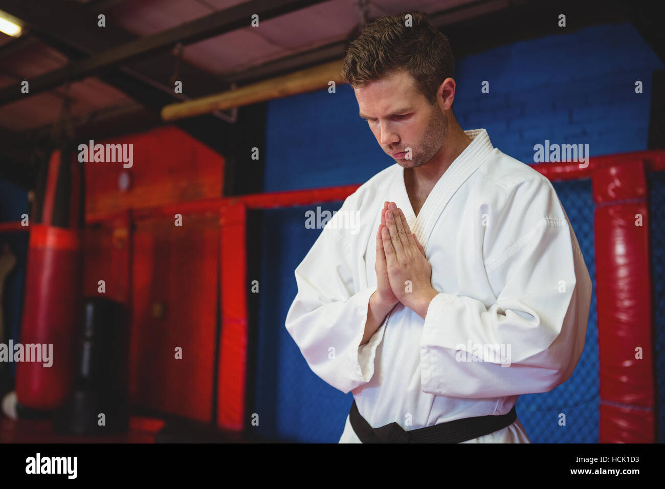 Karate player in prayer pose Stock Photo - Alamy