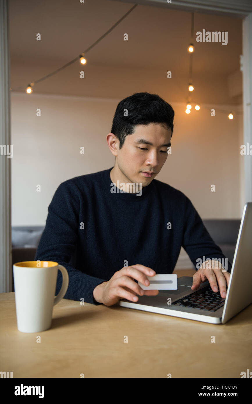 Asian man online shopping hi-res stock photography and images - Alamy