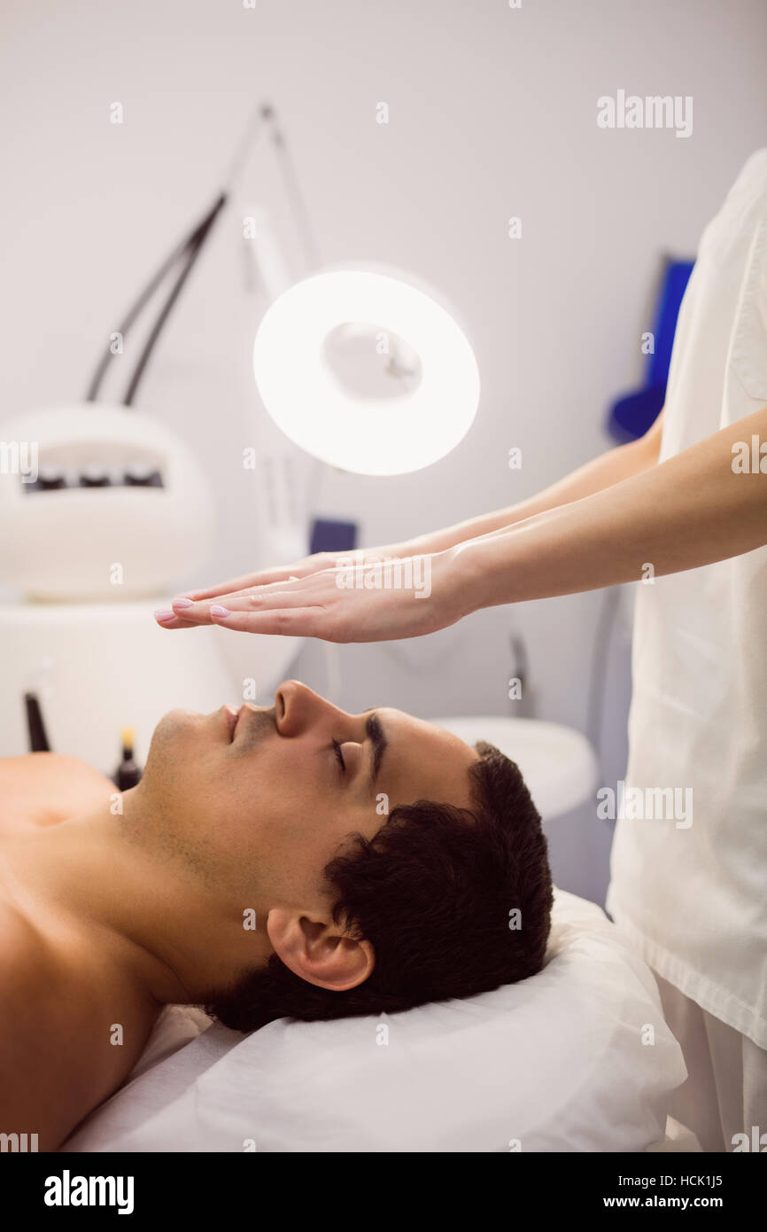Patient receiving facial treatment Stock Photo - Alamy