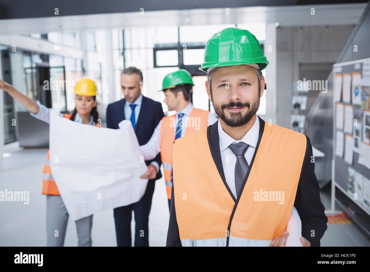 Confident architect smiling Stock Photo - Alamy Confident architect smiling Stock Photo - Alamy