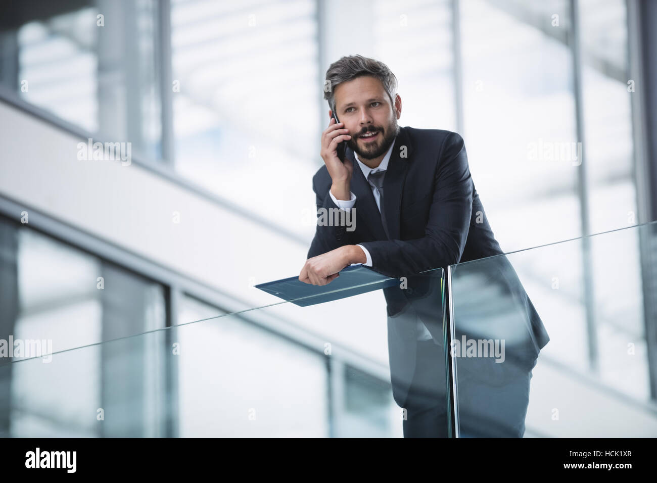 Businessman using mobile phone Stock Photo - Alamy