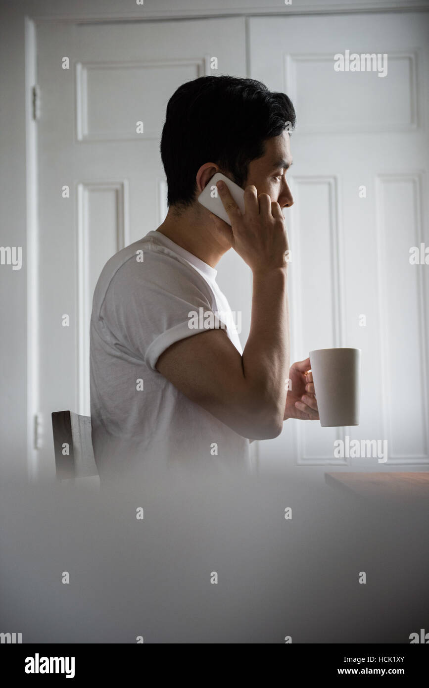 Asian man talking phone hi-res stock photography and images - Alamy
