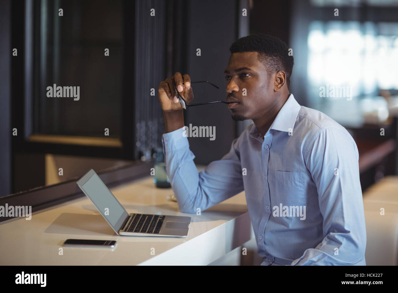 Businessman using laptop Stock Photo - Alamy