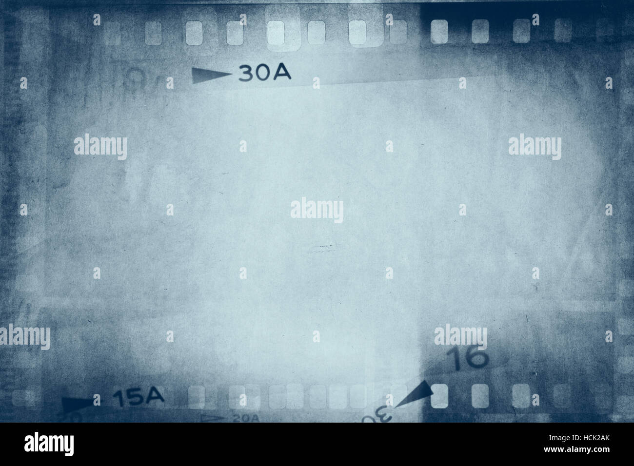 Film negative frames on blue background Stock Photo - Alamy