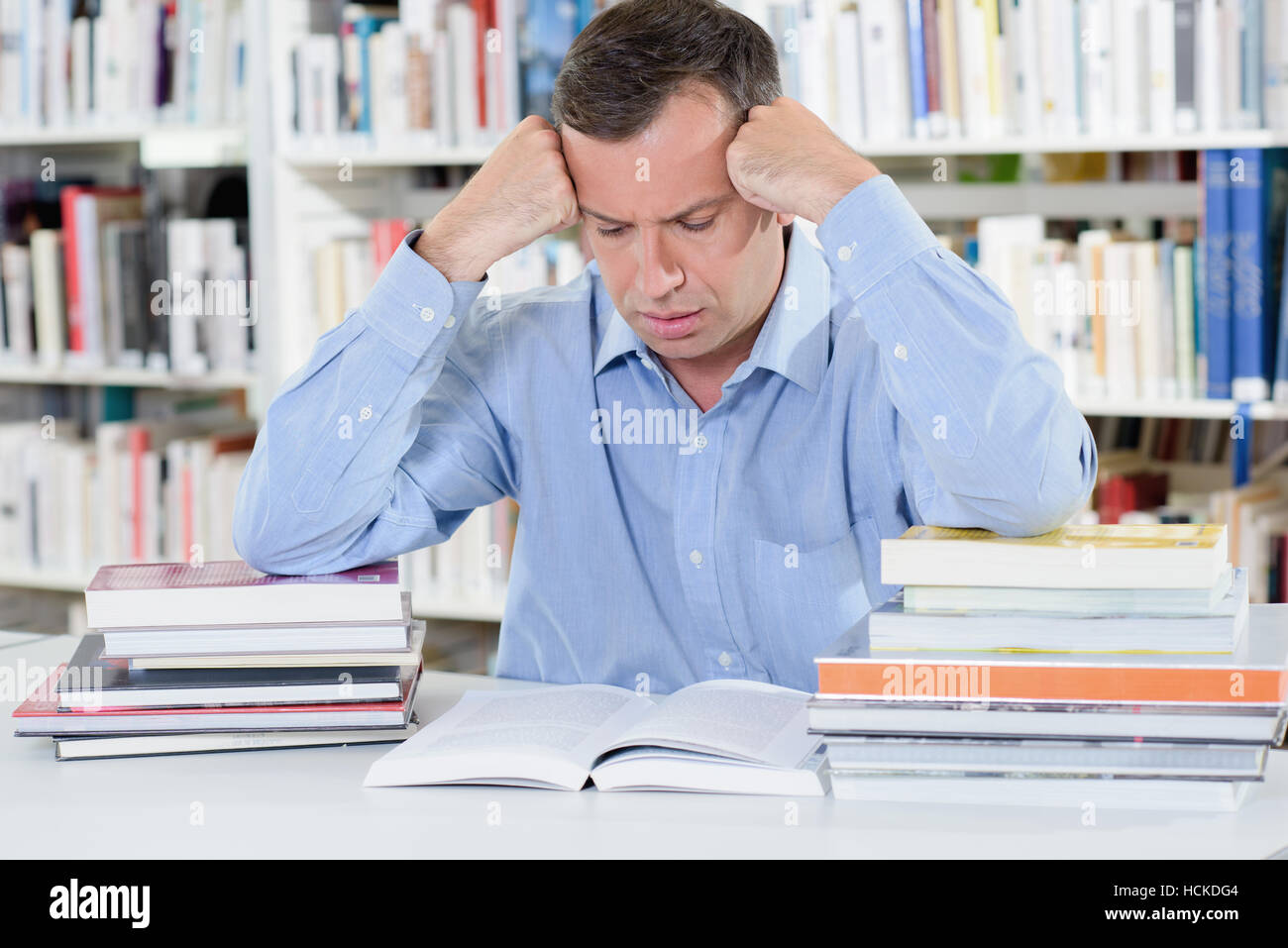 man with books Stock Photo - Alamy