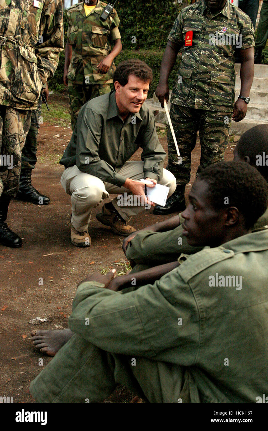 REPORTER, Nicholas Kristof (crouching), 2009 Stock Photo - Alamy