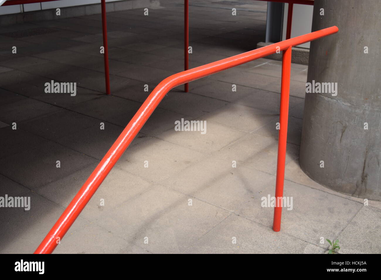 Red painted railings in an industrial area Stock Photo - Alamy