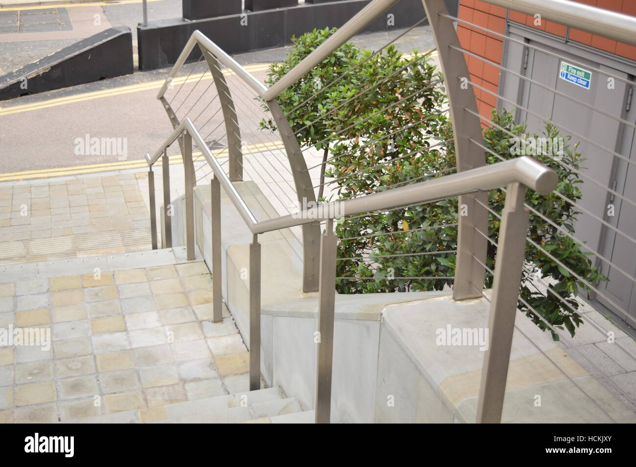 Metallic railing down to the street Stock Photo - Alamy