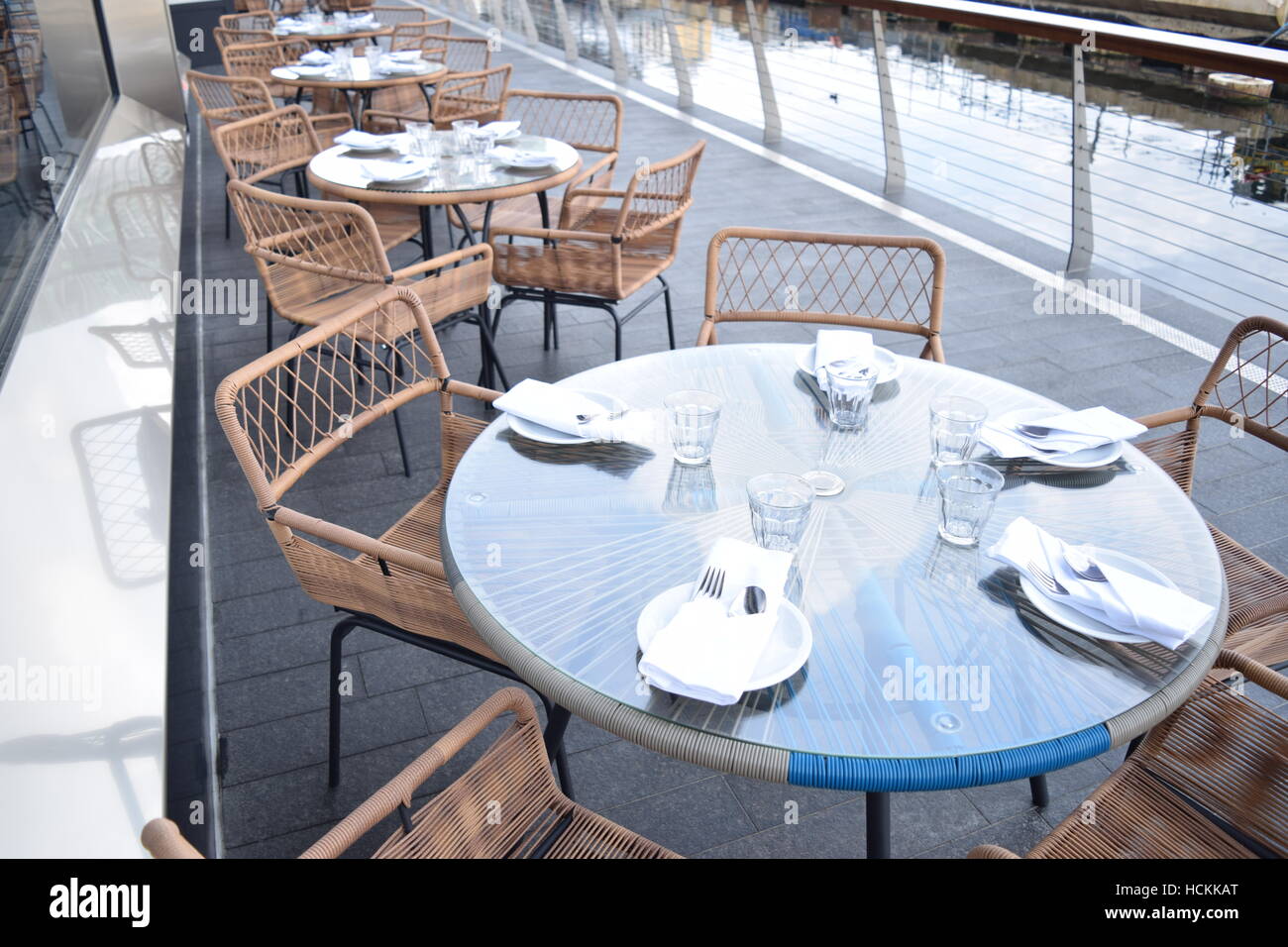 Beautiful outdoor seating area of a restaurant on a bridge Stock Photo ...