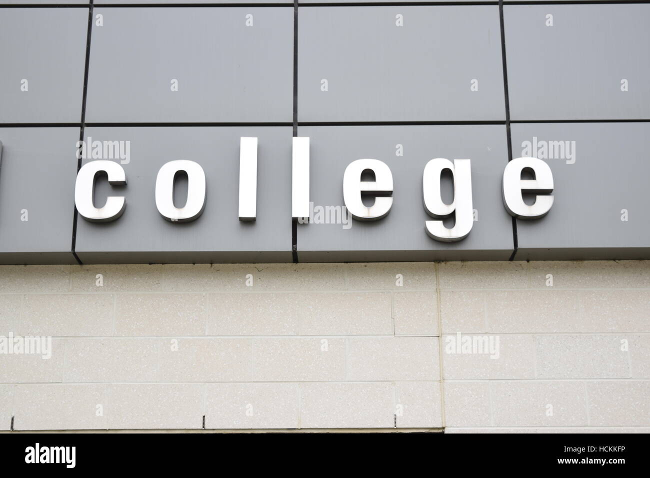 Large sliver sign on a college building Stock Photo - Alamy