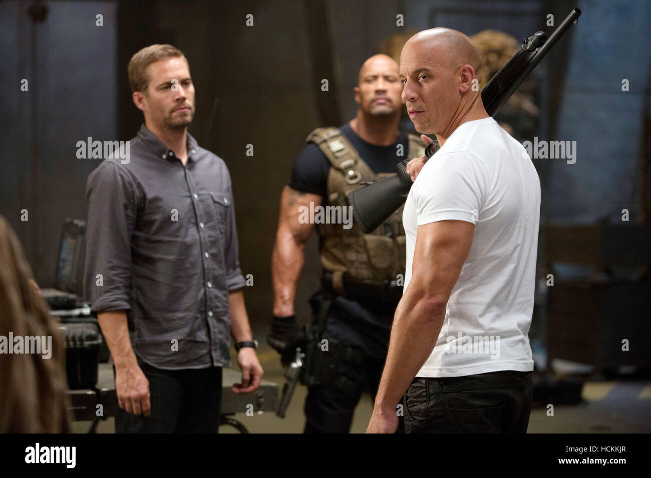 FAST & FURIOUS 6, from left: Paul Walker, Dwayne Johnson, Vin Diesel, 2013. ph: Giles Keyte ...
