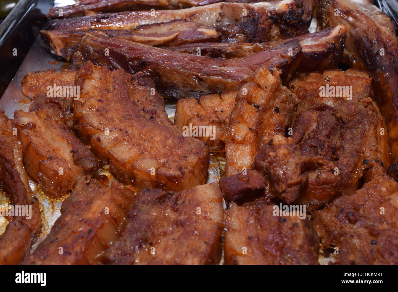 Freshly baked types of meat in a baking tray Stock Photo - Alamy