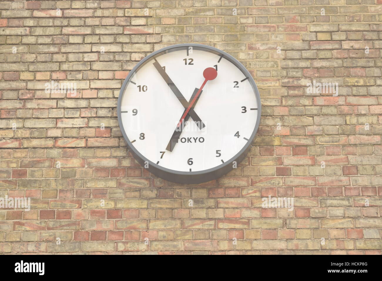 Large black and white clock showing the time in Tokyo Stock Photo - Alamy