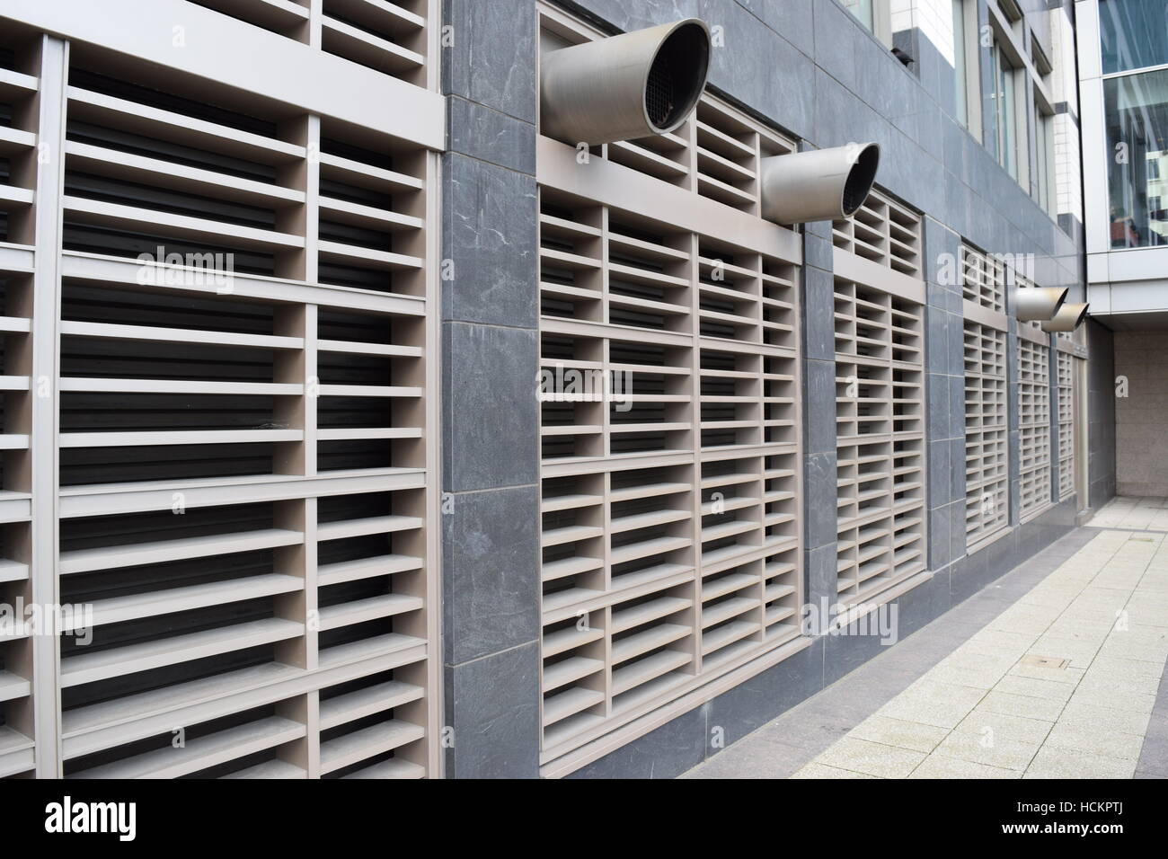 Large outdoor air vent on the wall with pipes Stock Photo - Alamy