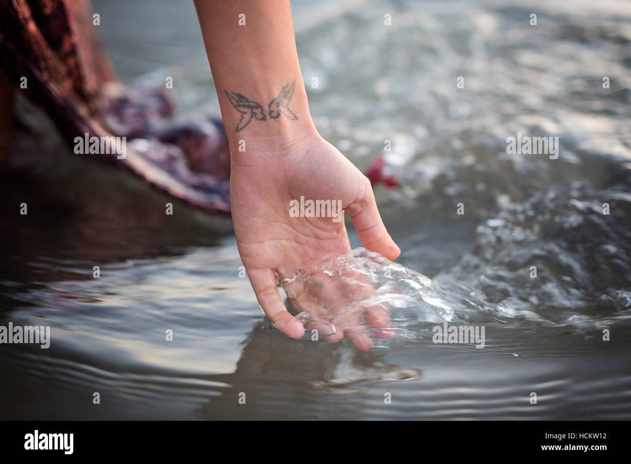 Woman's Hand in running water Stock Photo - Alamy