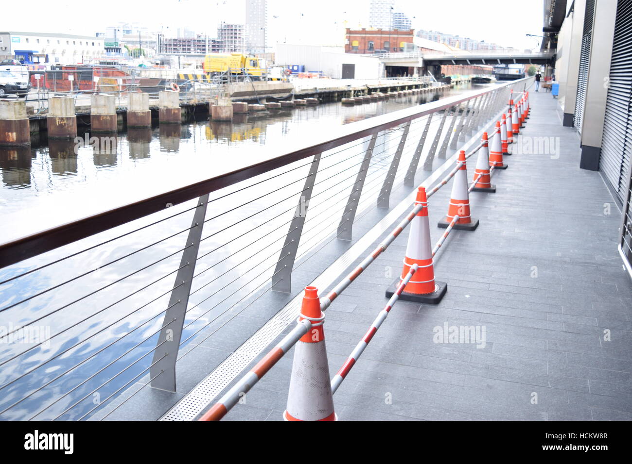 Long line of orange and white cone on a bridge showing caution Stock ...
