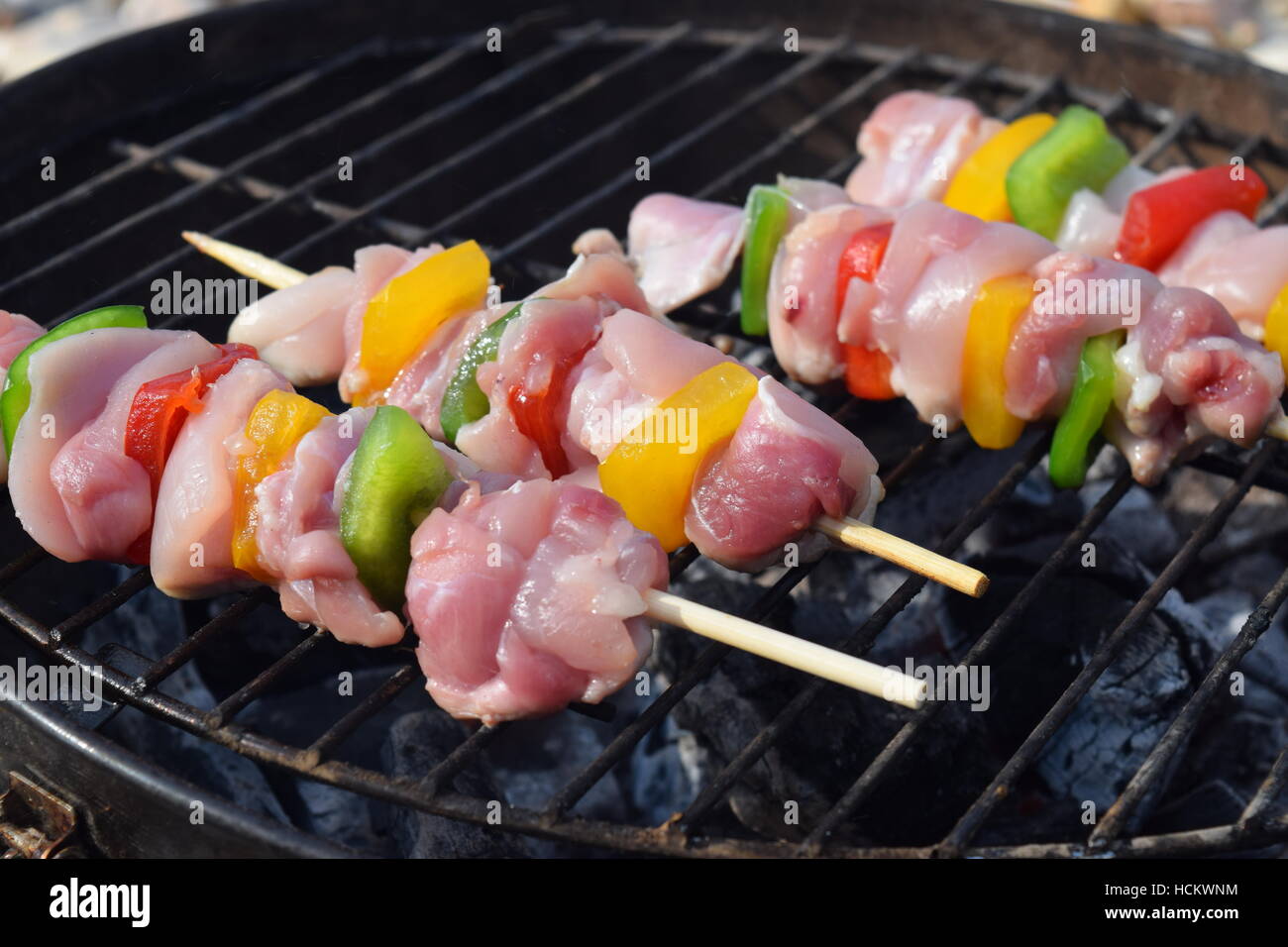 Farm fresh chicken cooking on a barbecue Stock Photo - Alamy