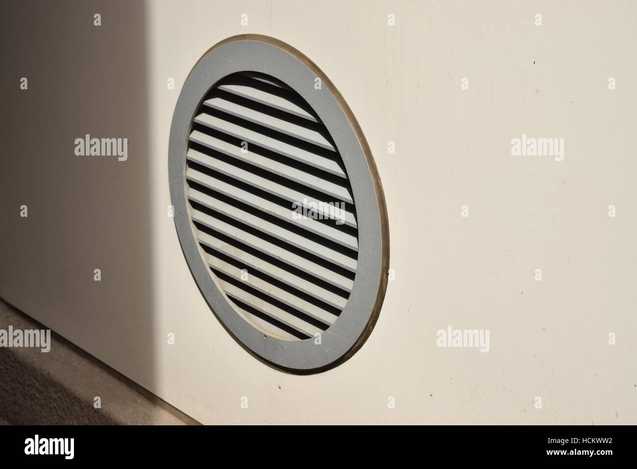Circular air vent indoors with shadow effect; side perspective Stock ...